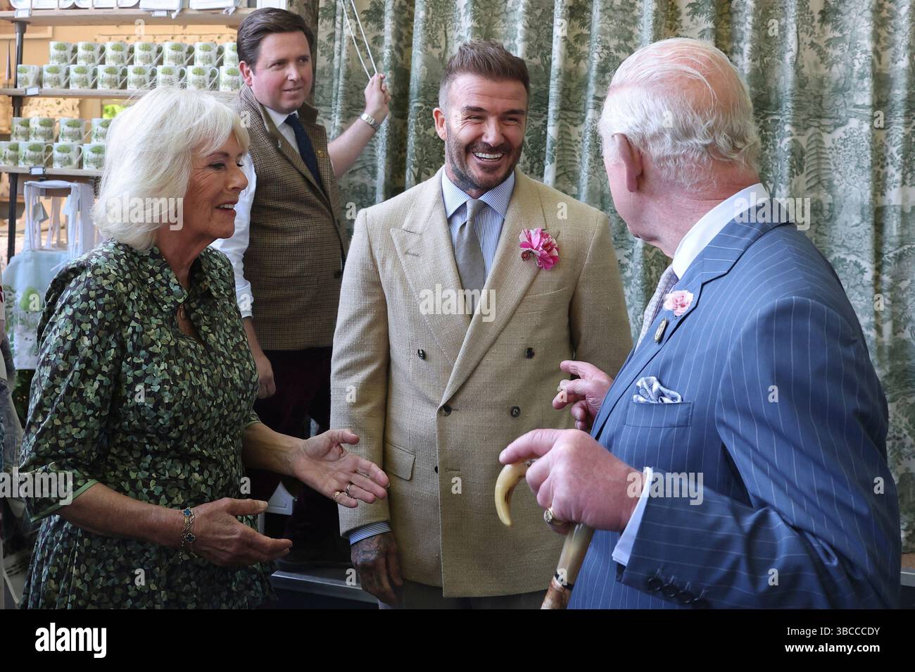 Britain's King Charles III and Queen Camilla speak with David Beckham ...