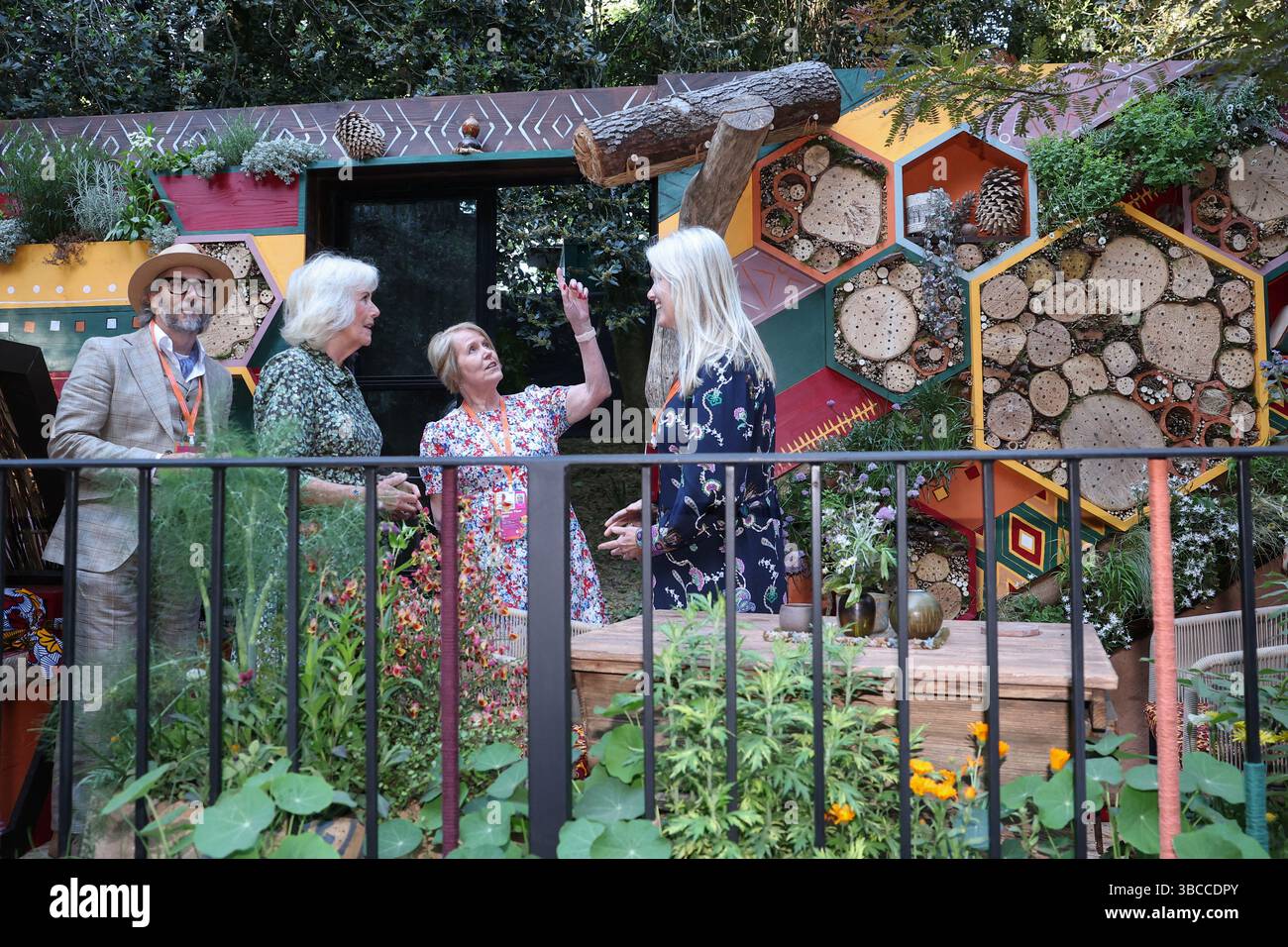 Queen Camilla is shown a bees-in-conservation display, during a visit ...