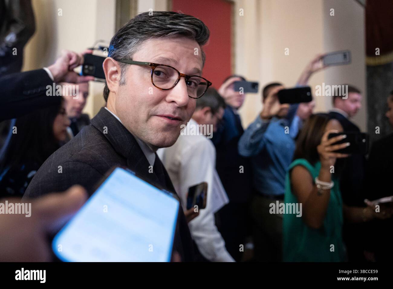 House Speaker Mike Johnson (R-La.) speaks with reporters as he walks ...