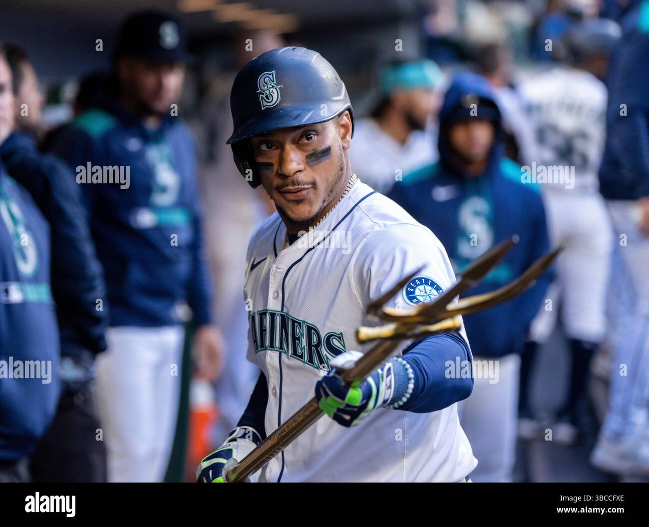 Seattle Mariners' Jorge Polanco celebrats in the dugout after hitting a ...