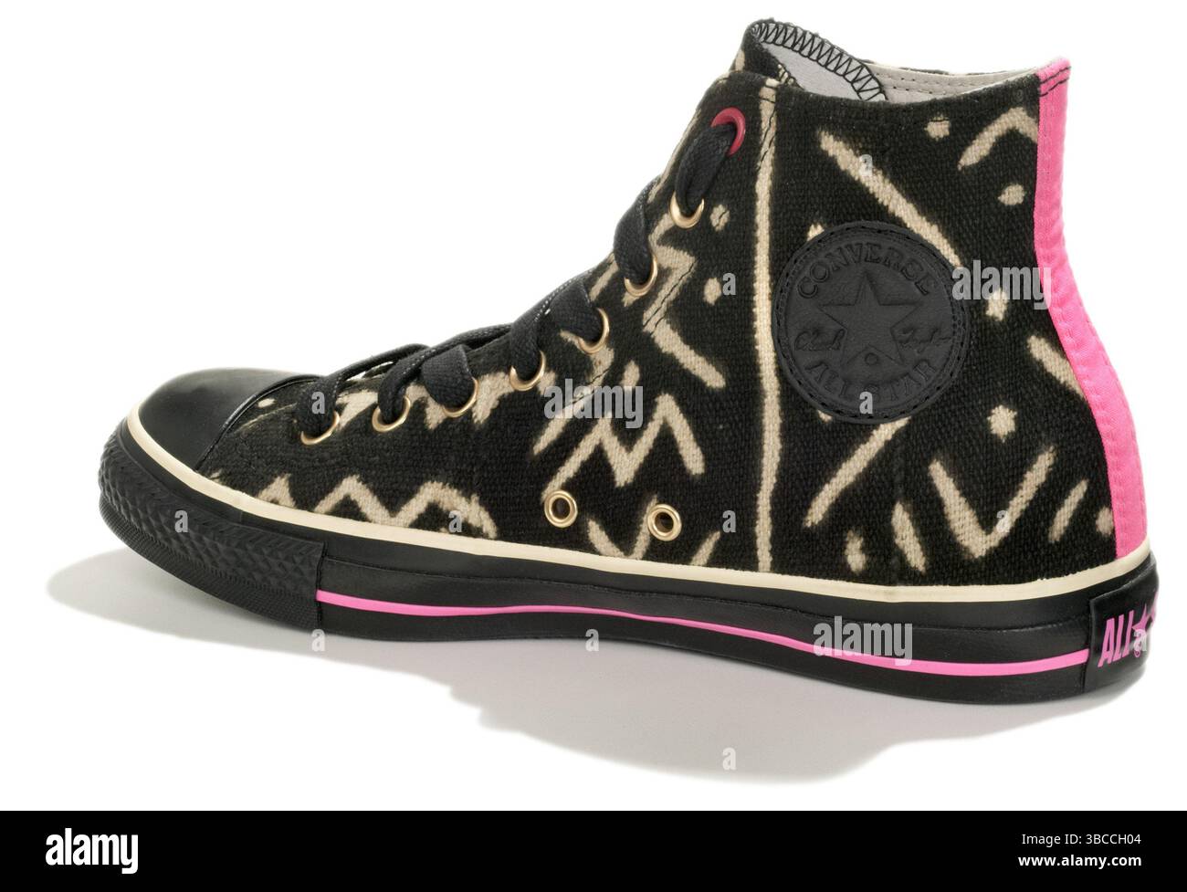 black converse shoe photographed on a white background Stock Photo - Alamy