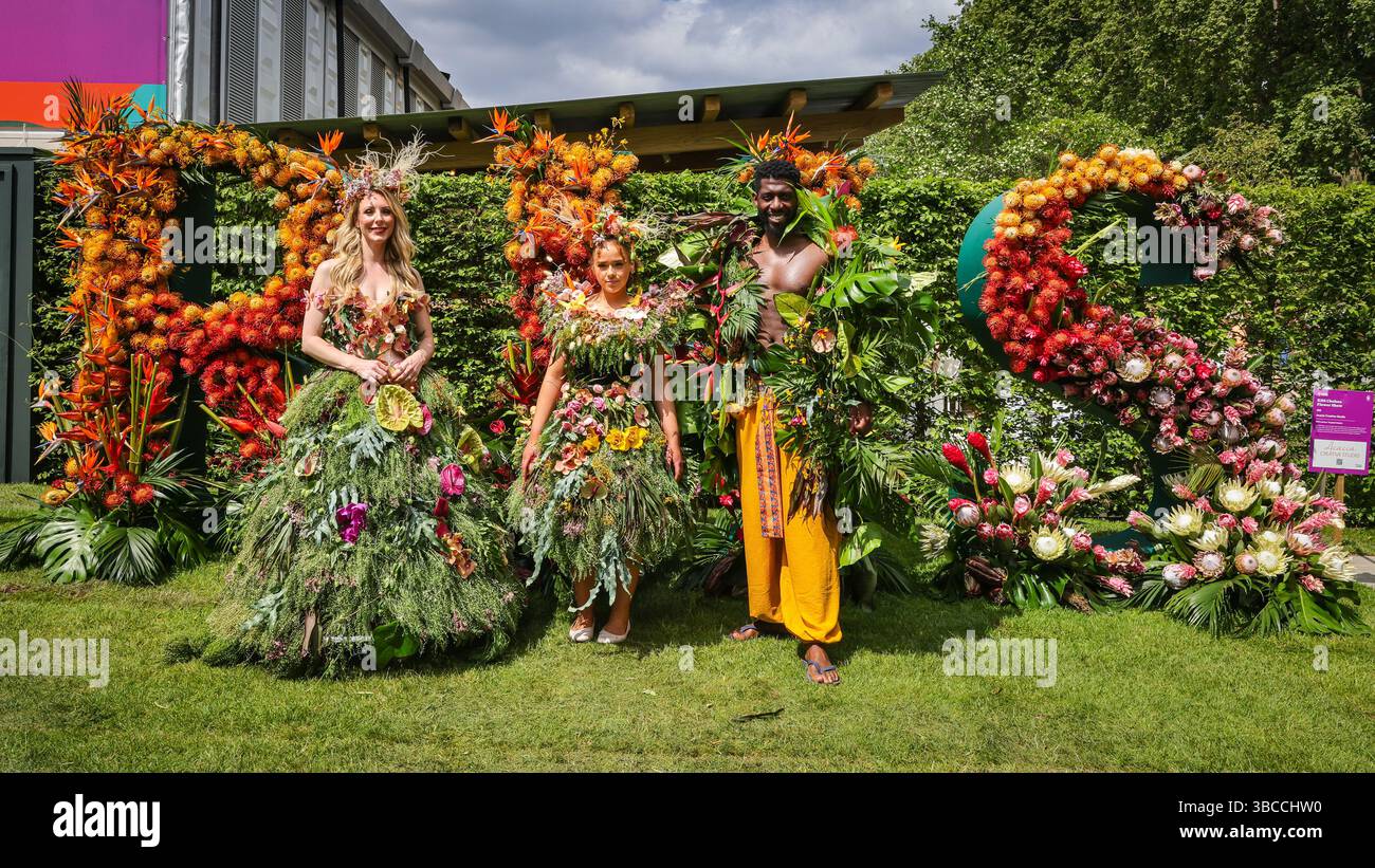 London, UK. 19th May, 2025. Models in beautiful floral outfits pose ...