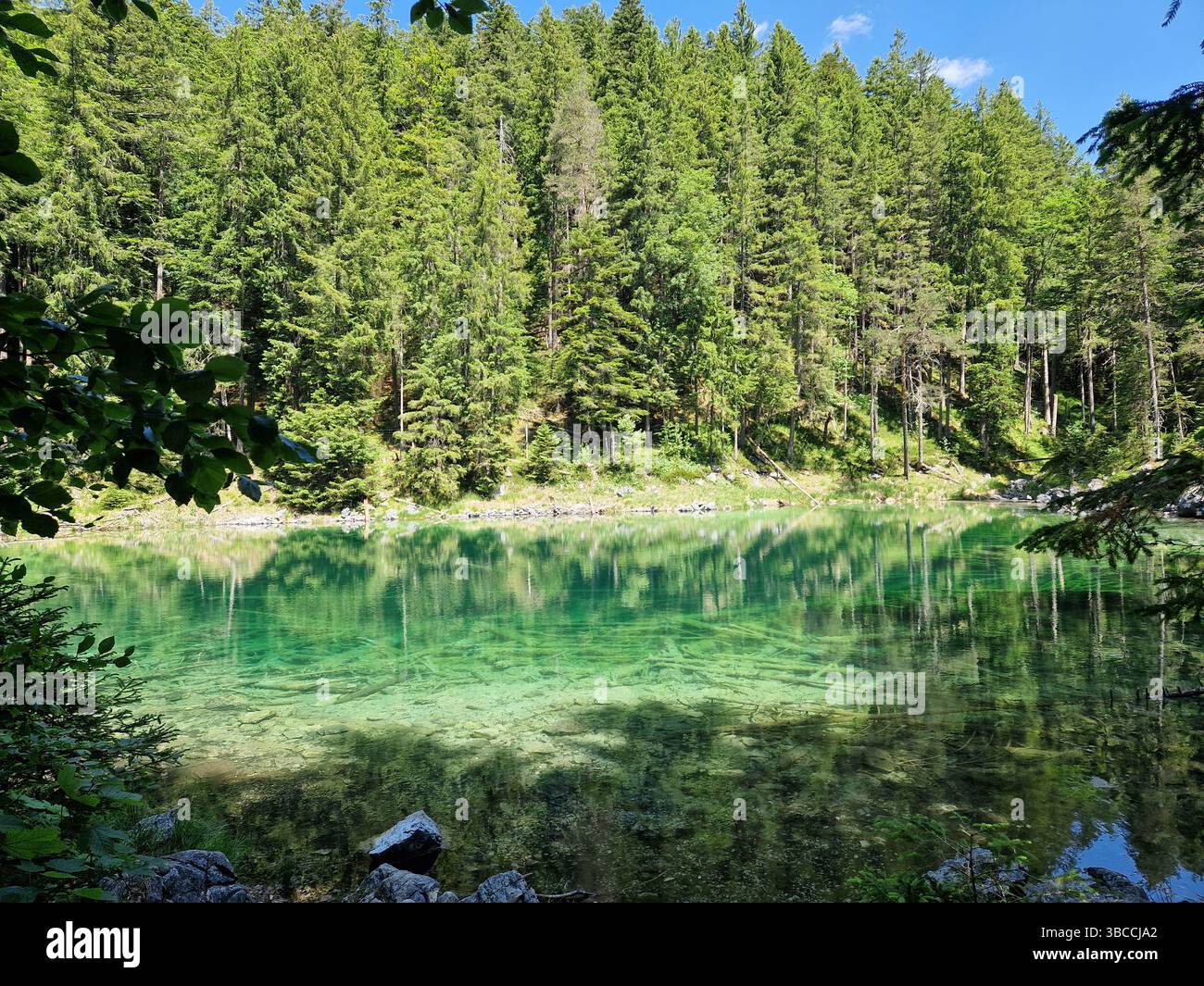 Mountain peak Zugspitze Summer day at lake Eibsee near Garmisch ...