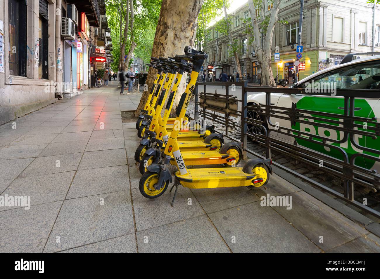 Tbilisi, Georgia. May 16 2025. Electric scooters for rent on a city ...