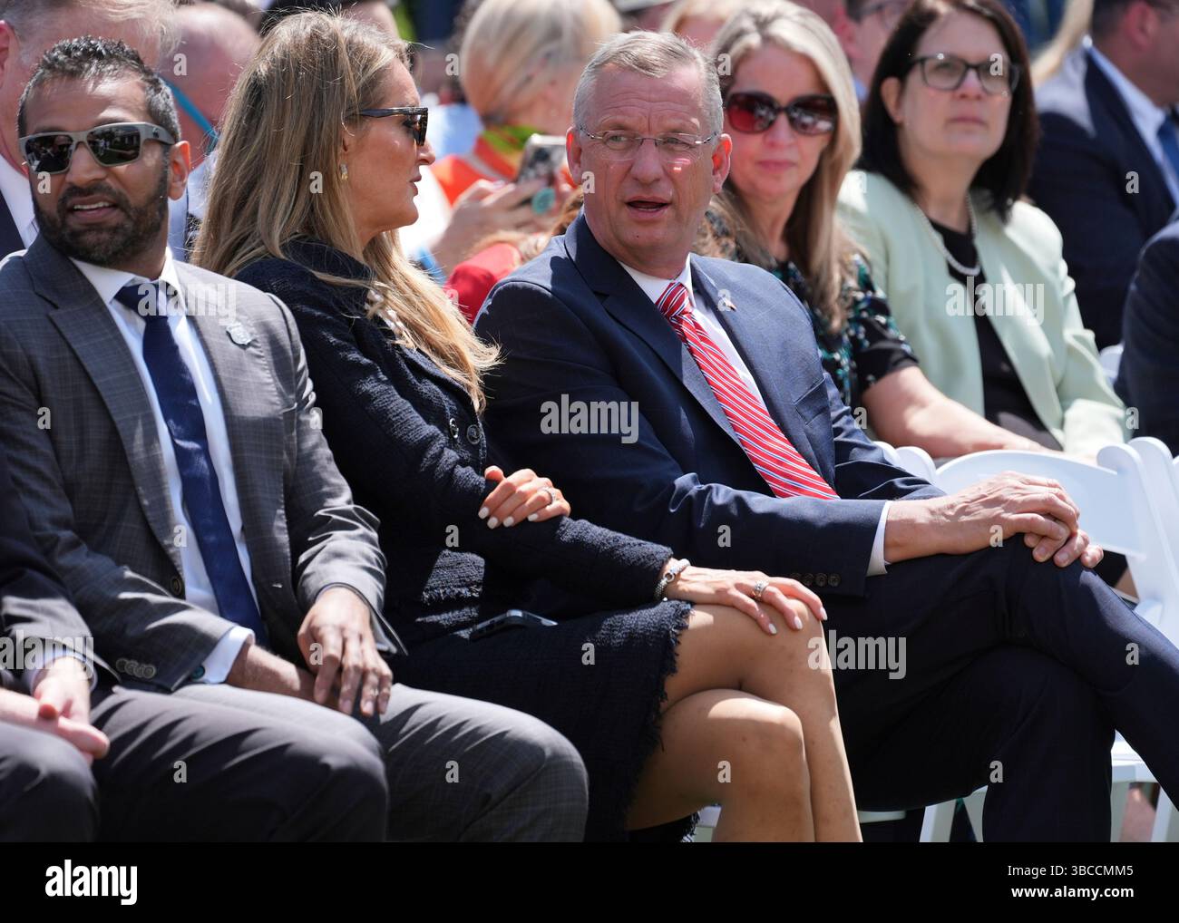 Secretary of Veterans Affairs Doug Collins, center, and FBI Director ...