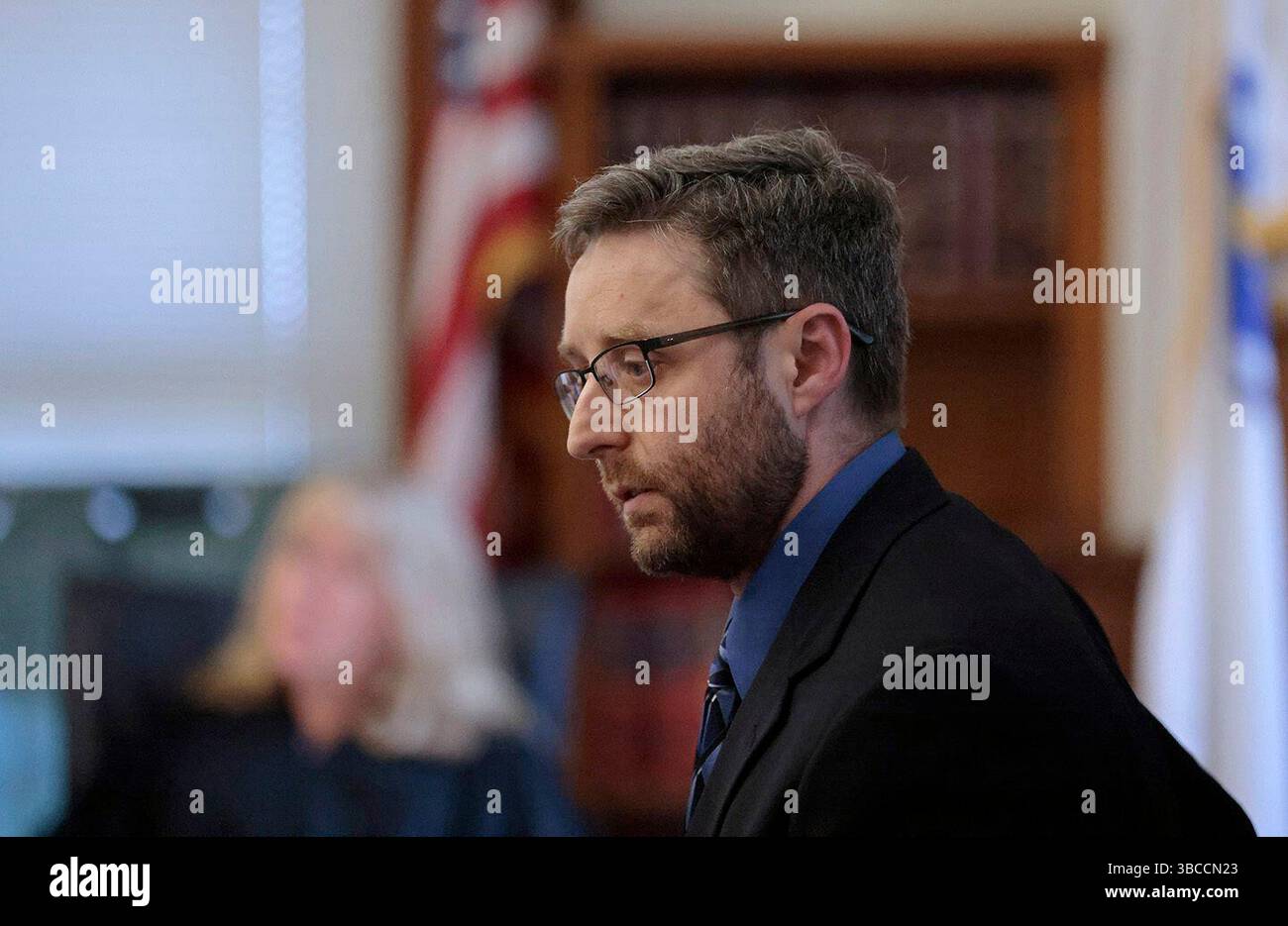Nicholas Bradford, with Bode Technology lab, leaves the stand after ...
