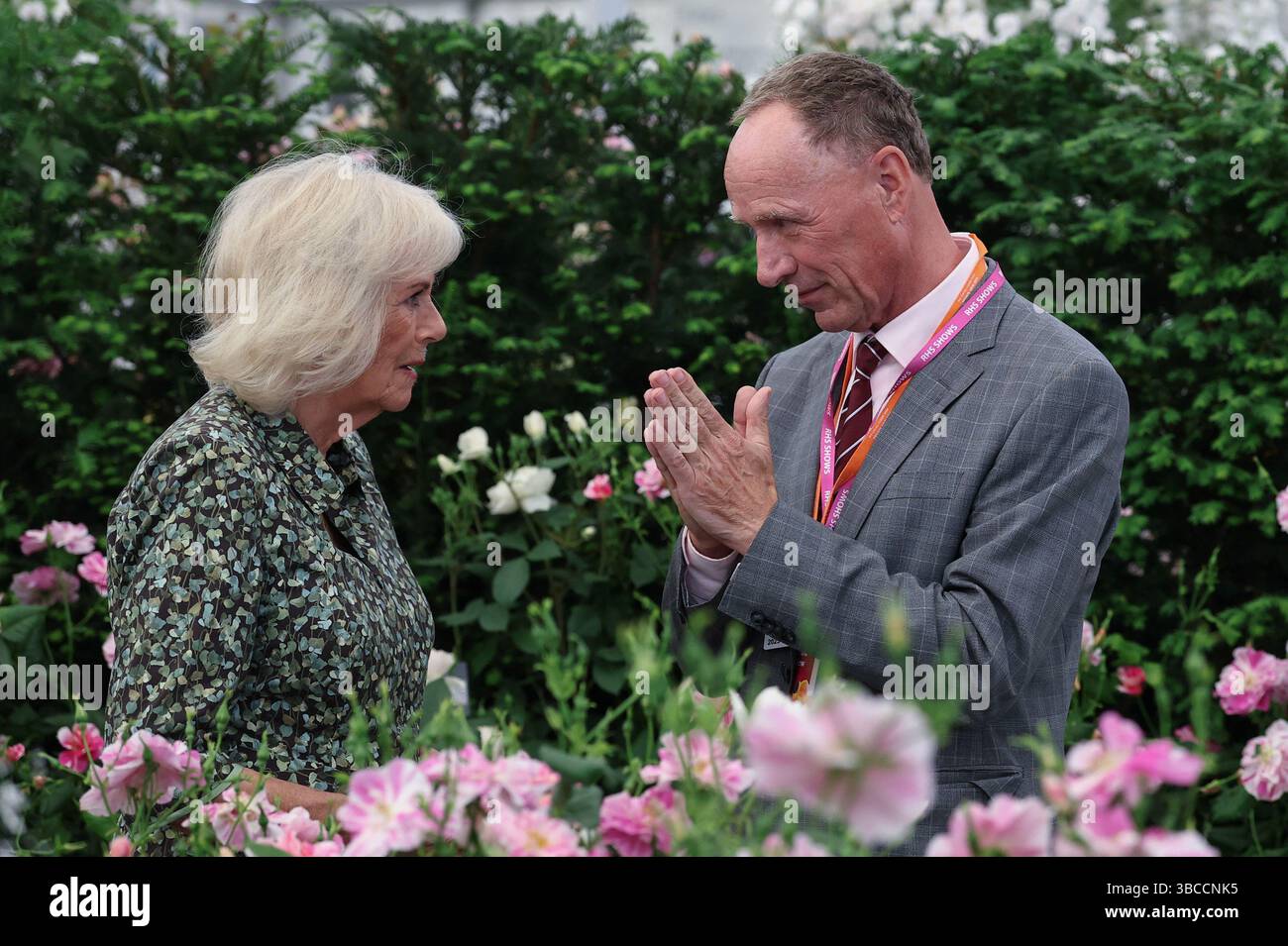 Queen Camilla speaks with David Austin of David Austin Roses, during a ...