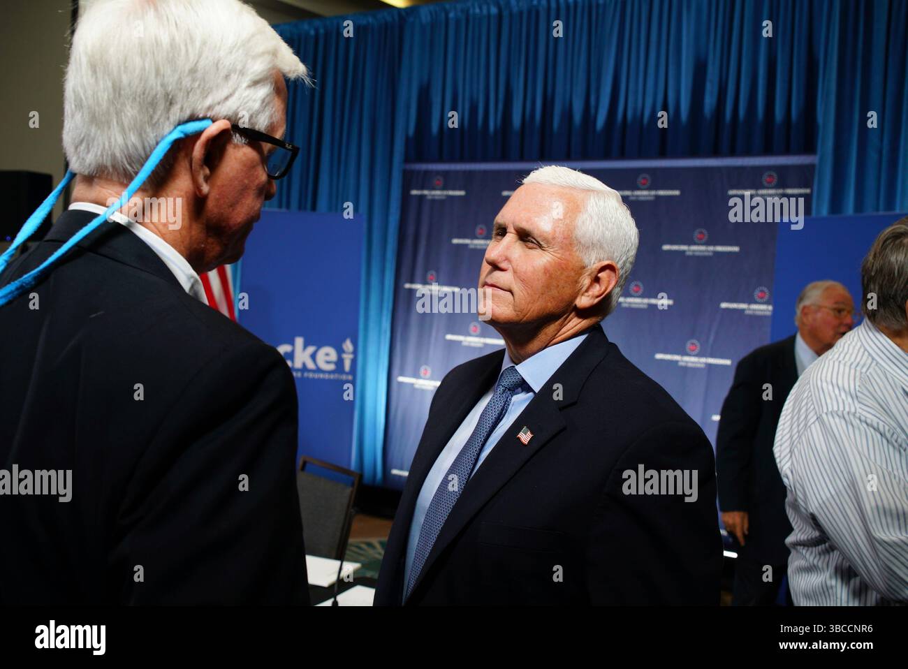 Former Vice President Mike Pence, right, speaks with businessman H.O ...