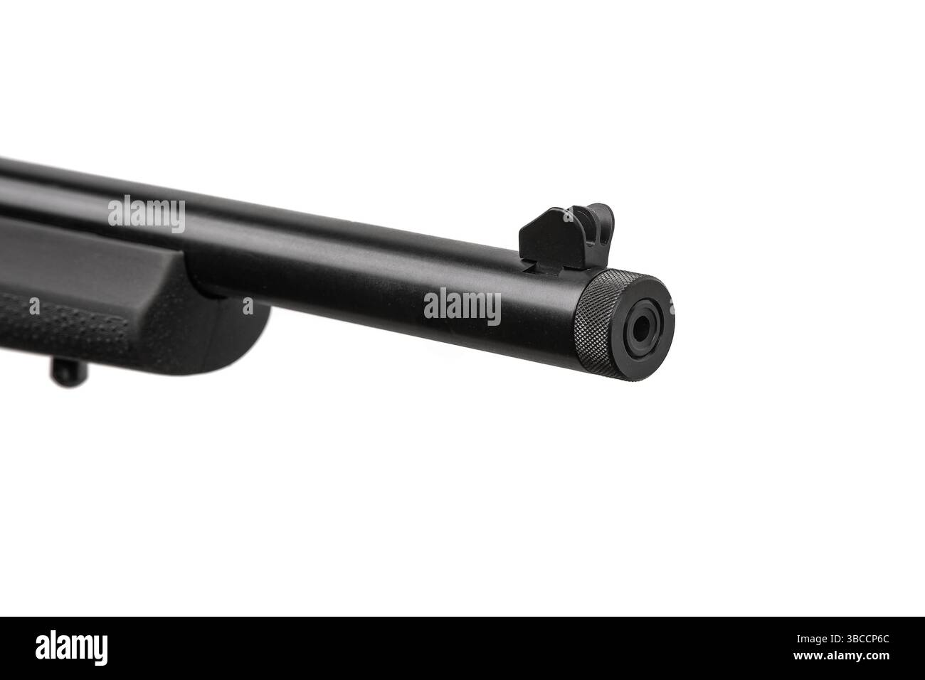 Close-up of rifle muzzle with front sight and threaded barrel tip ...