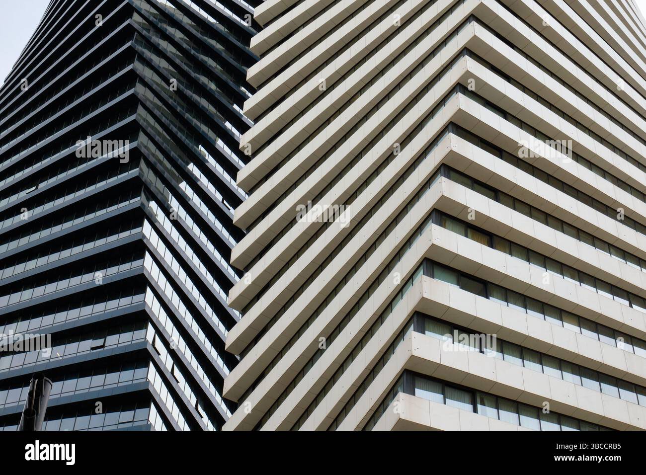 Two contrasting skyscrapers showcase distinct architectural styles ...