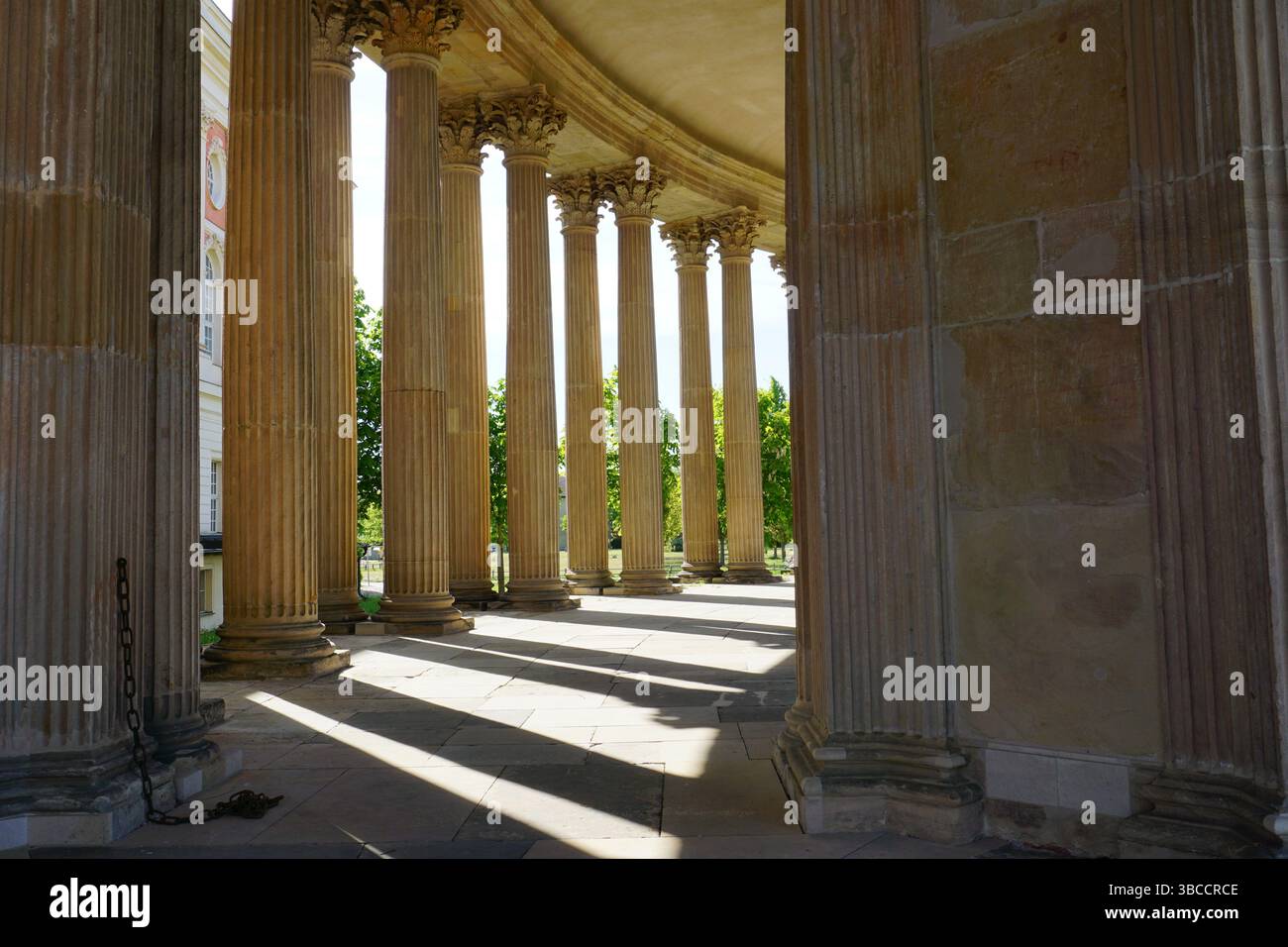 Light and shadow between the historic columns of the landmark colonnade ...