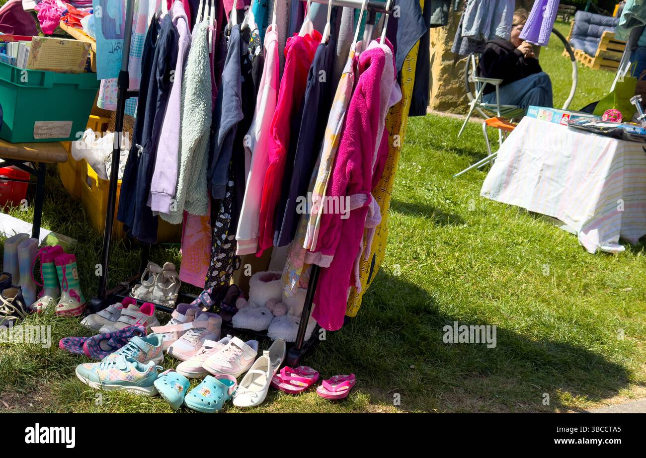 clothes on the flea market shopping Stock Photo - Alamy