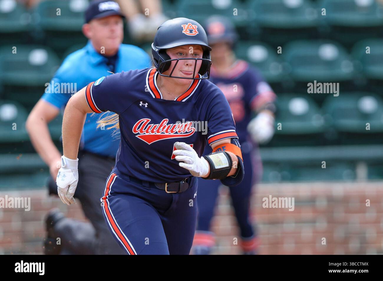 Auburn utility AnnaLea Adams (14) runs to first base during an NCAA ...
