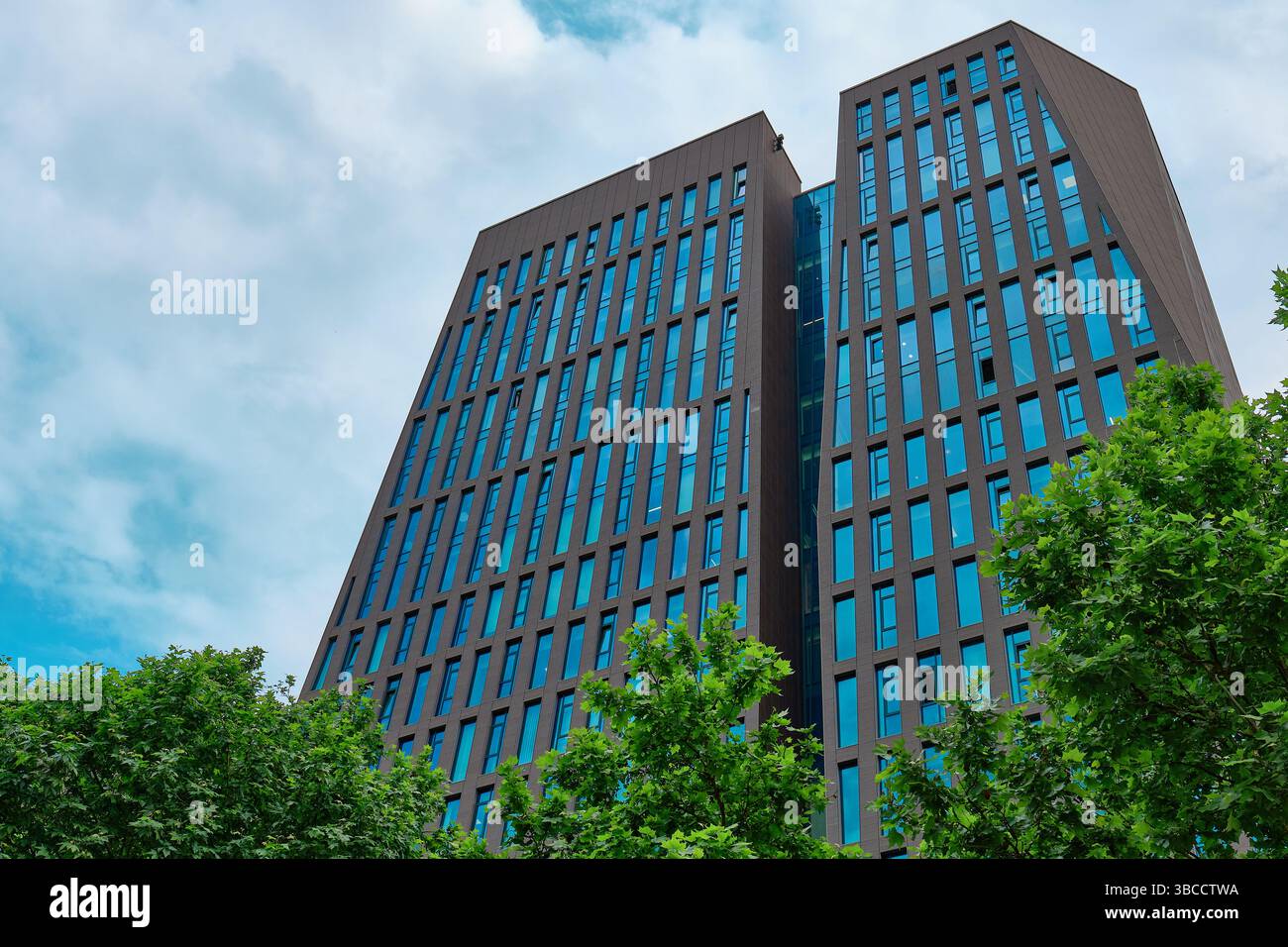 Tall structures with glass facades showcase modern architecture amid ...