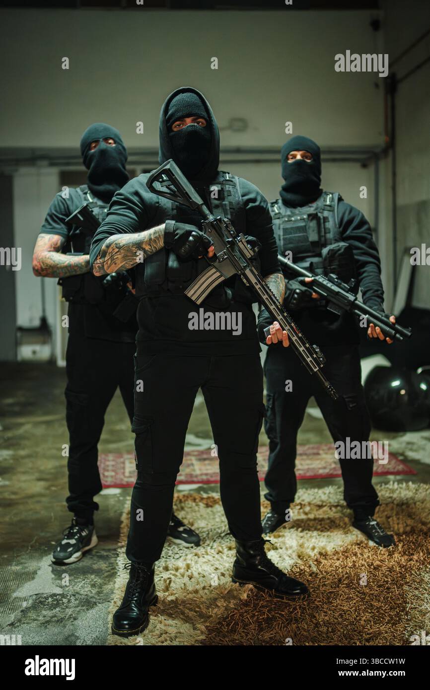 A powerful trio of mercenaries stands ready for action, showcasing ...
