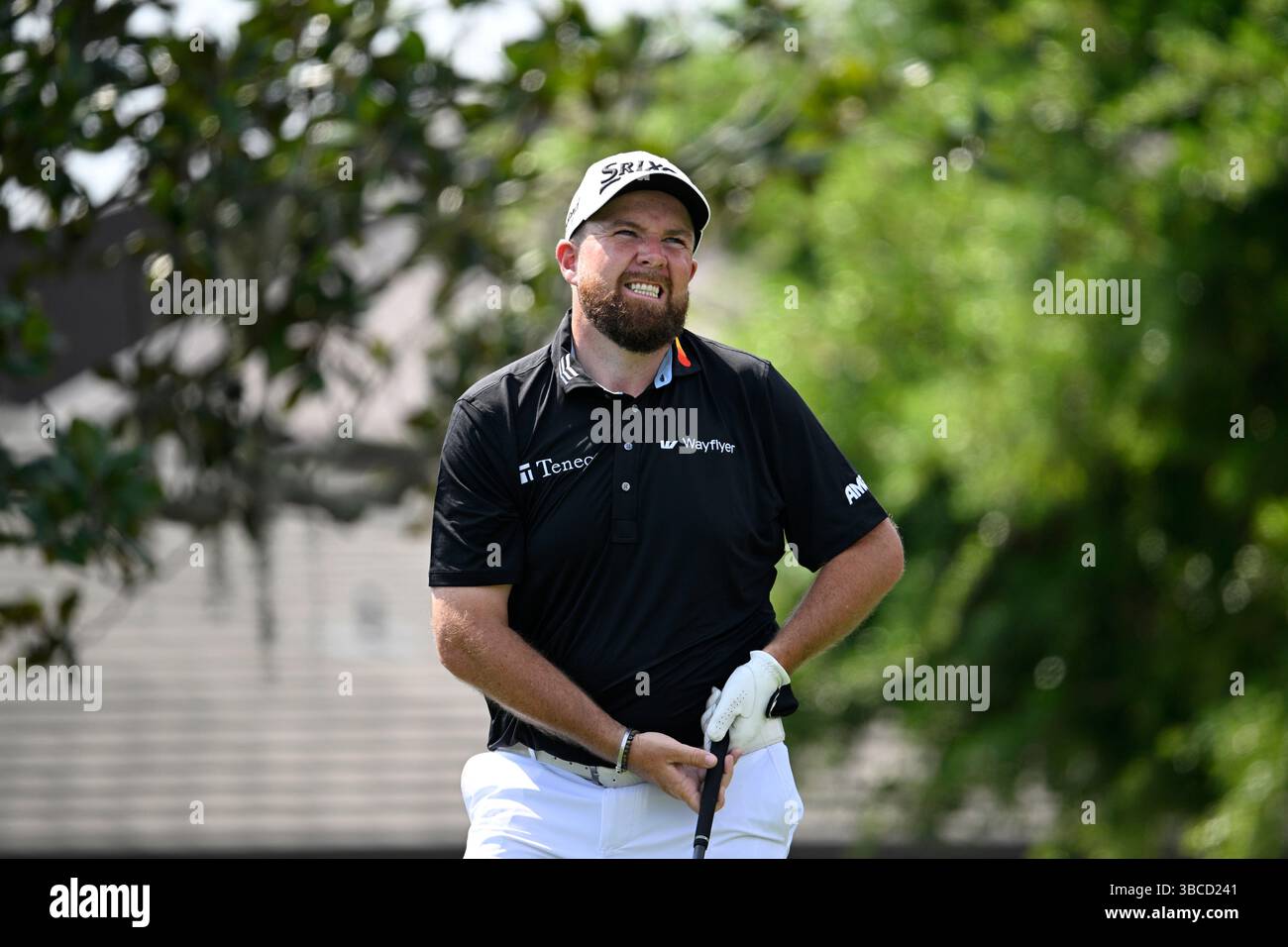 Shane Lowry, of Ireland, reacts after hitting his tee shot on the first ...