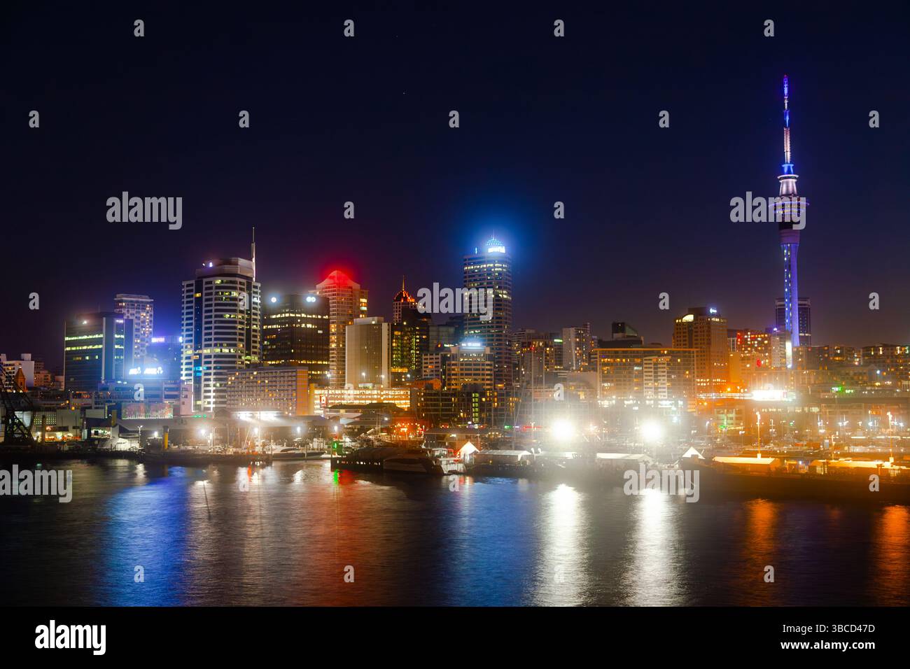 Night city of Auckland New Zealand. Glowing skyscrapers, bay and ...