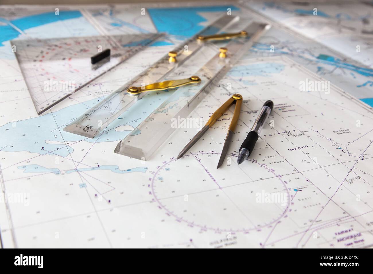 Maps of the ship for plotting. Plotter, divider, ruler and pen. Close ...