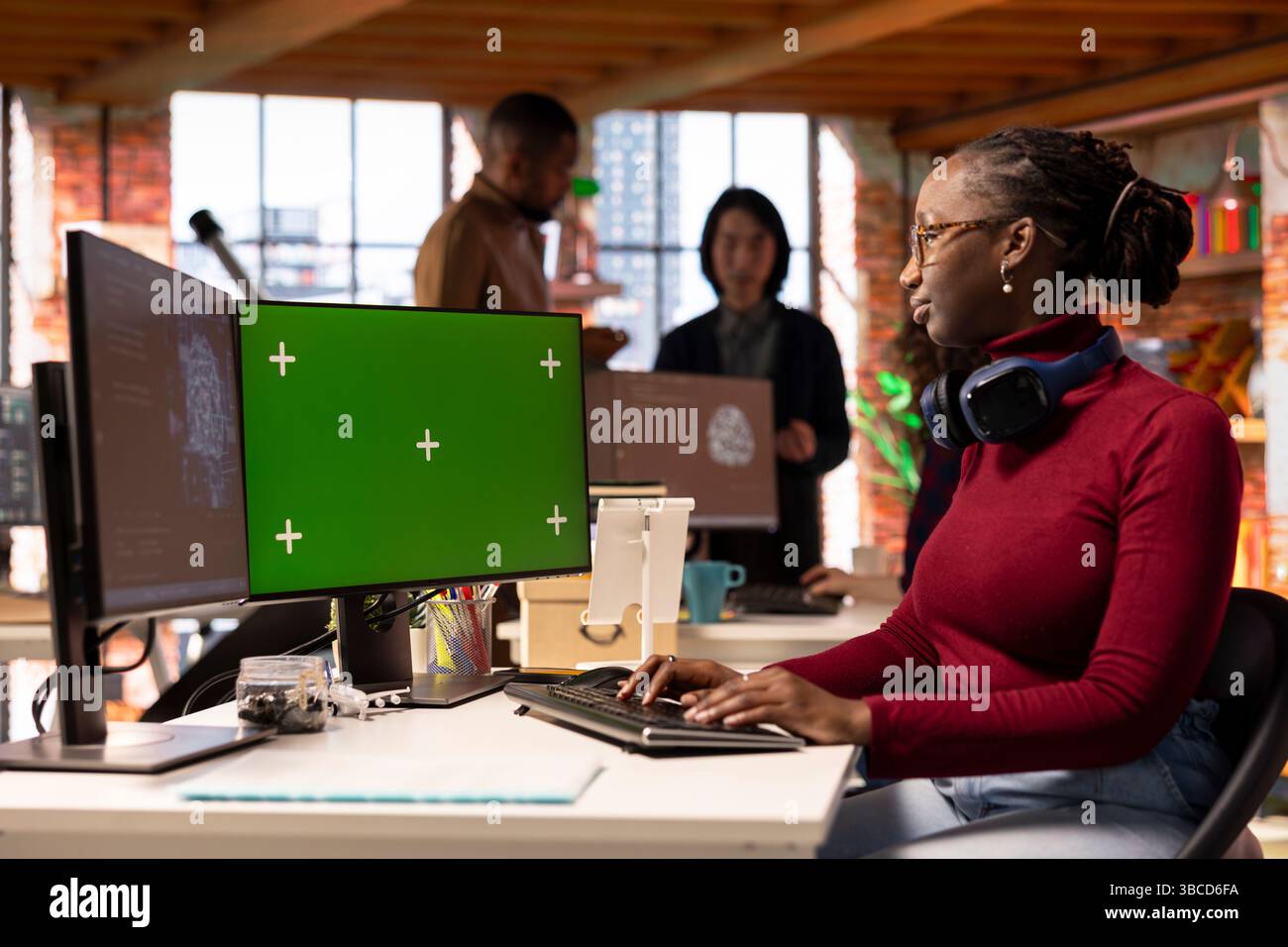 Green screen PC in workspace used by AI researcher working with artificial intelligence ...