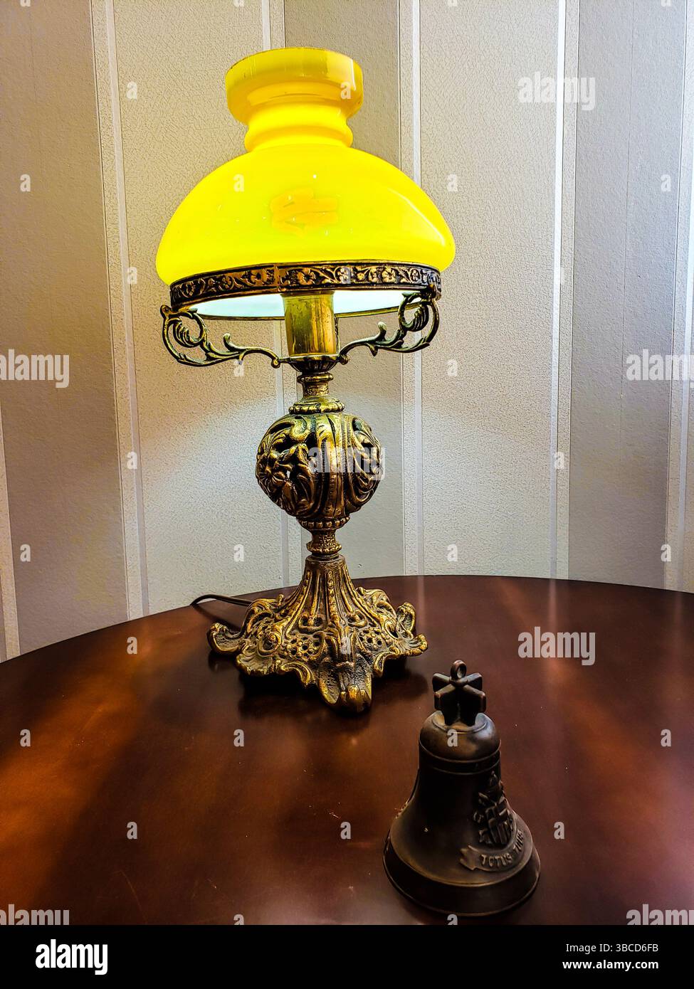 Beautiful lamp with a bell next to it on a beautiful shelf Stock Photo ...