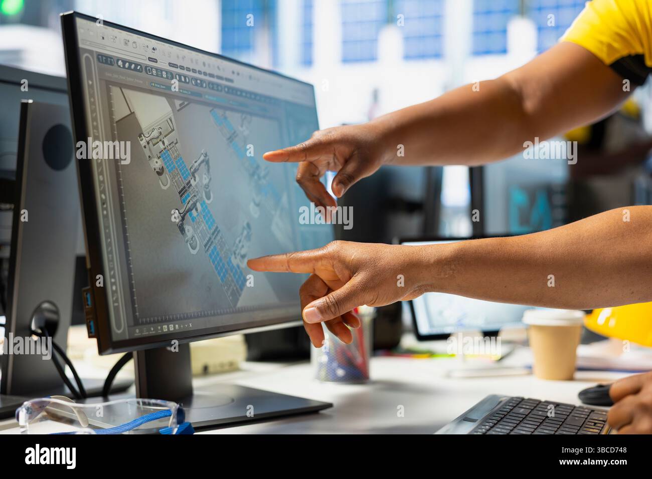 Technicians in photovoltaics factory reviewing solar panels assembly ...