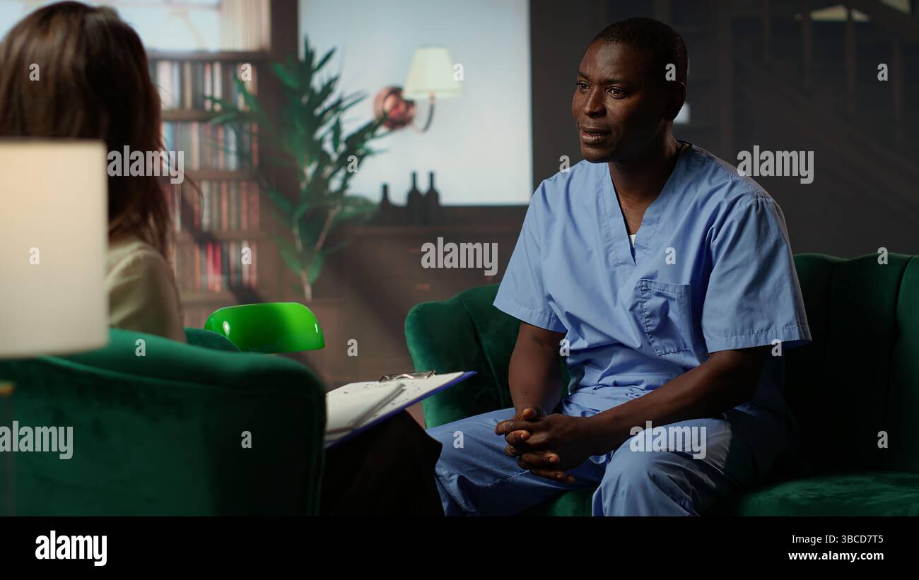 African american medical assistant in scrubs reflects on loss and burnout, sharing his feelings ...
