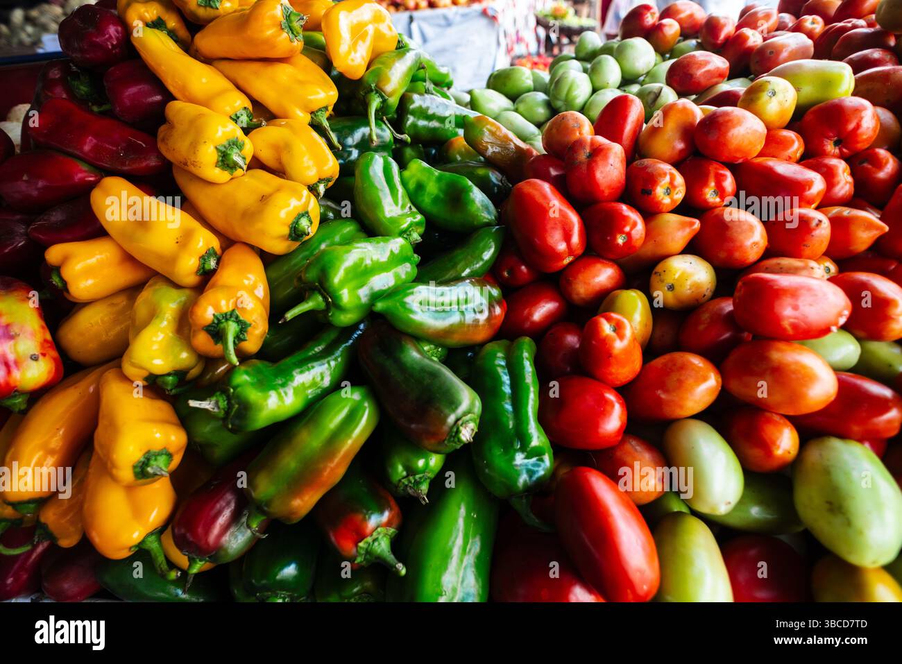 Vegetables, greens and legumes for sale at a street market counter ...