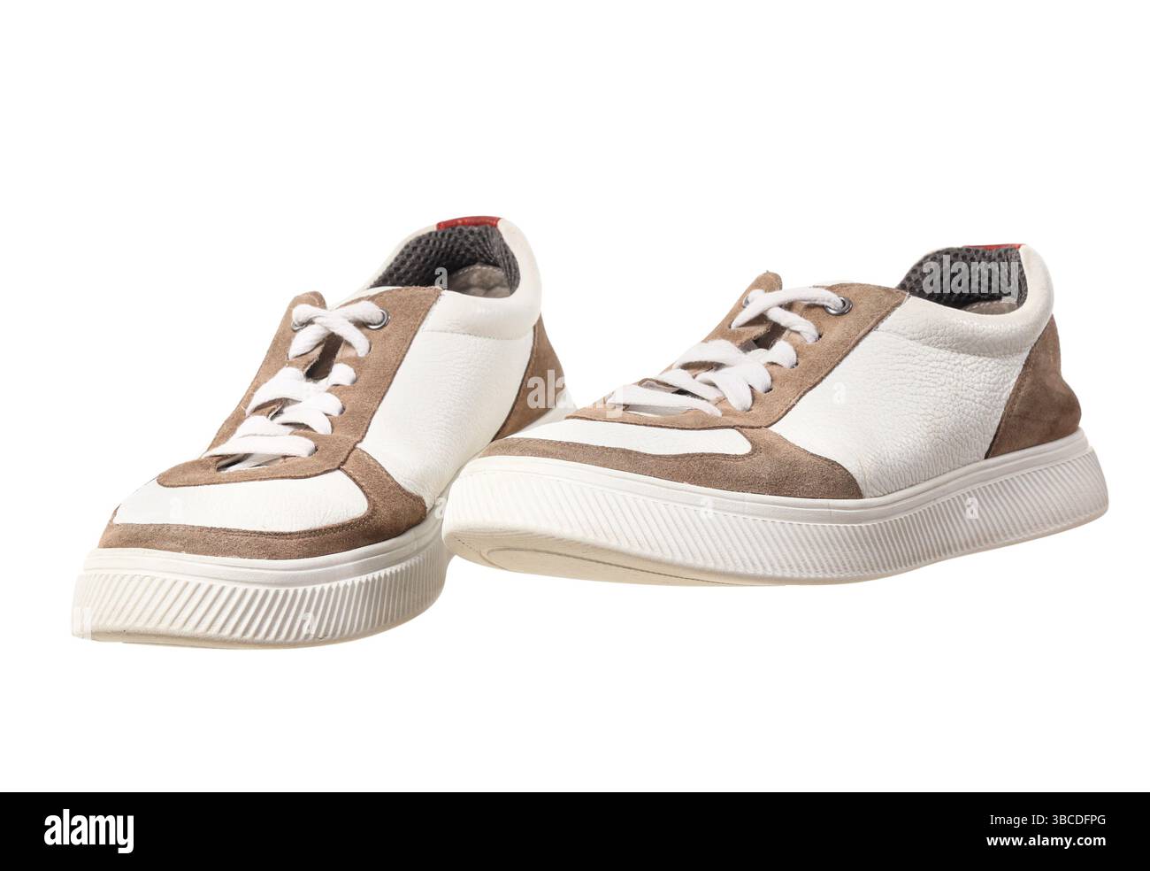 Flying sneakers isolated on white background Stock Photo - Alamy