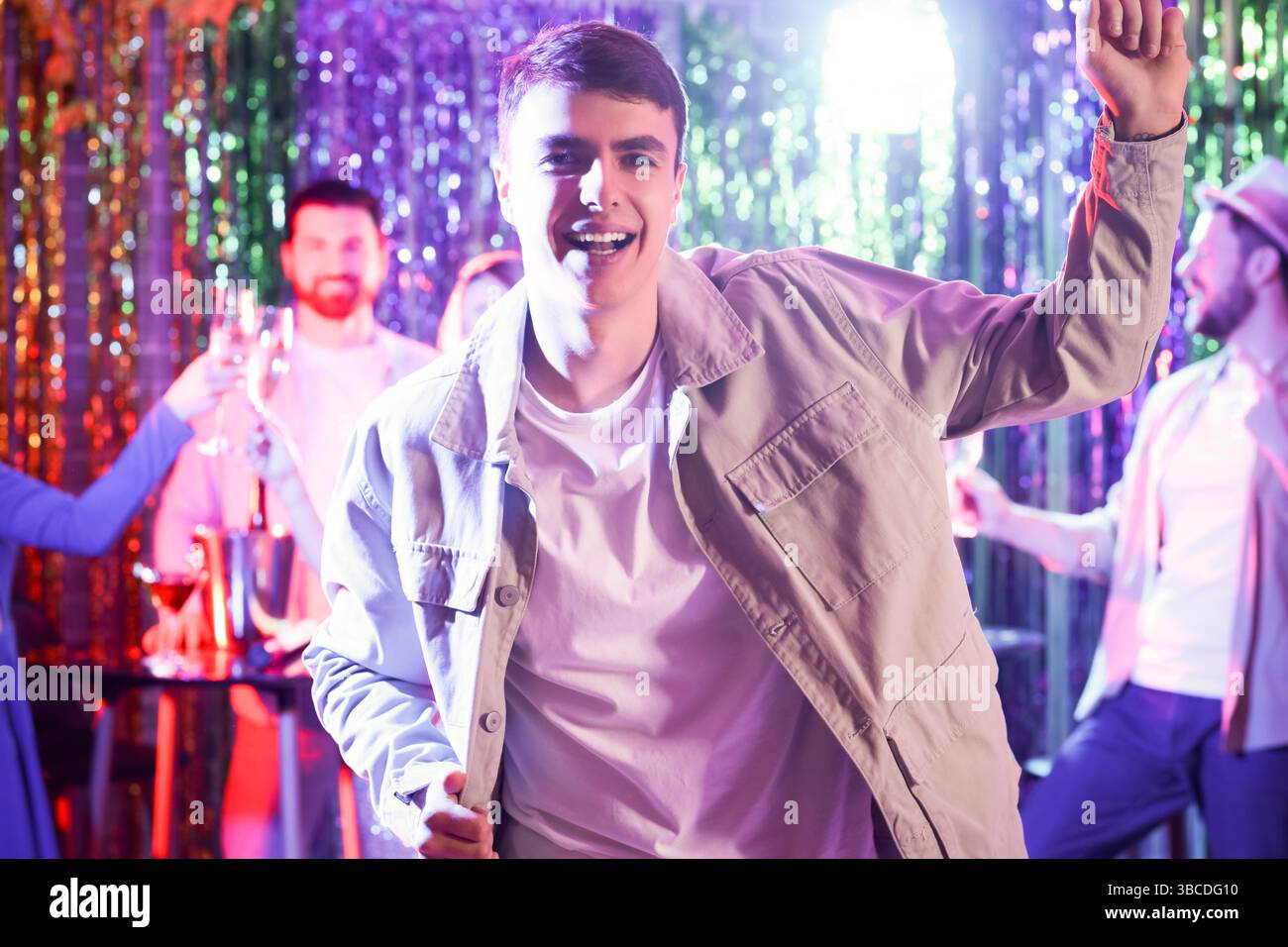 Young man dancing at party in night club Stock Photo - Alamy