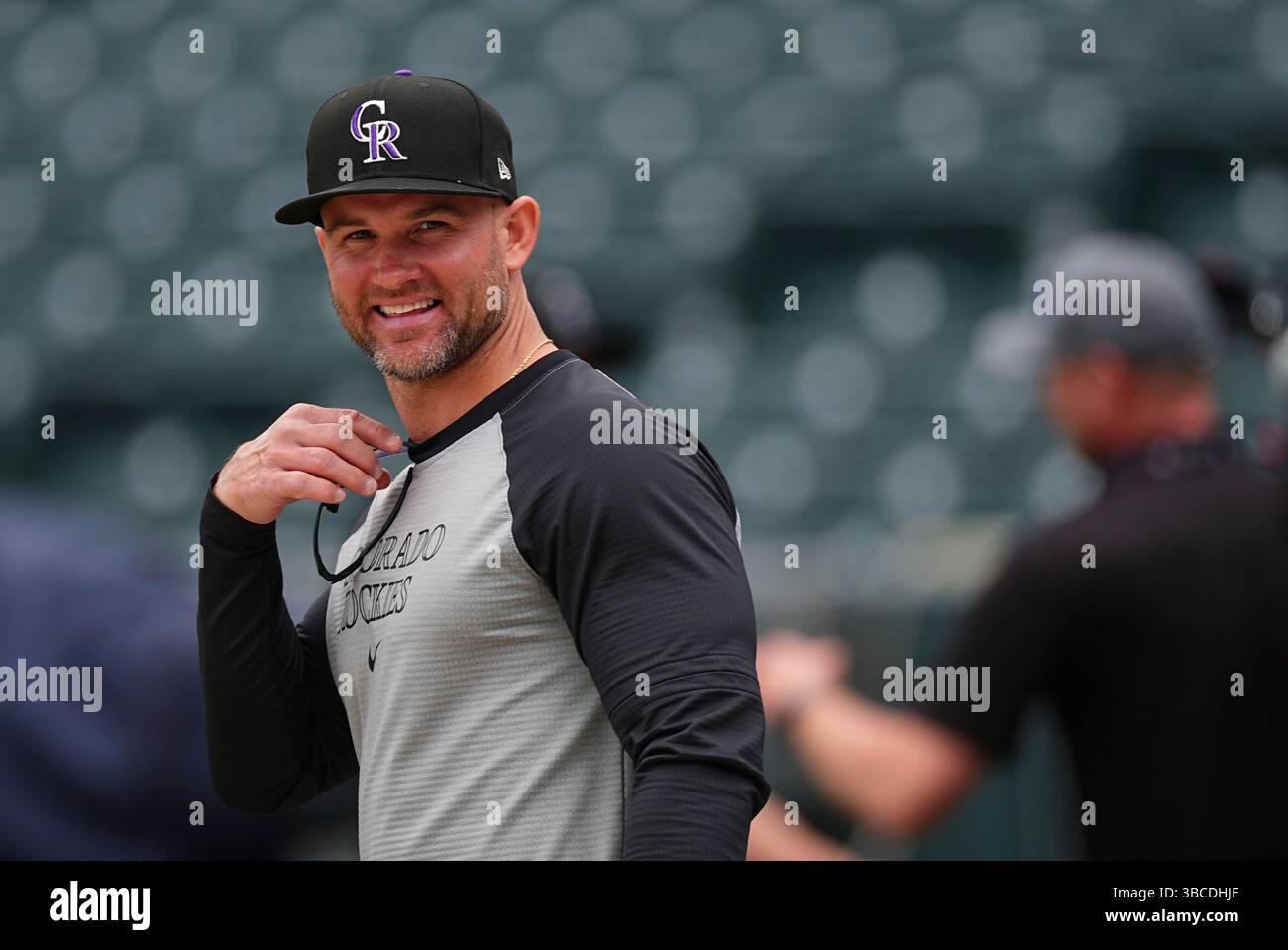 Colorado Rockies interim manager Warren Schaeffer looks on as players ...