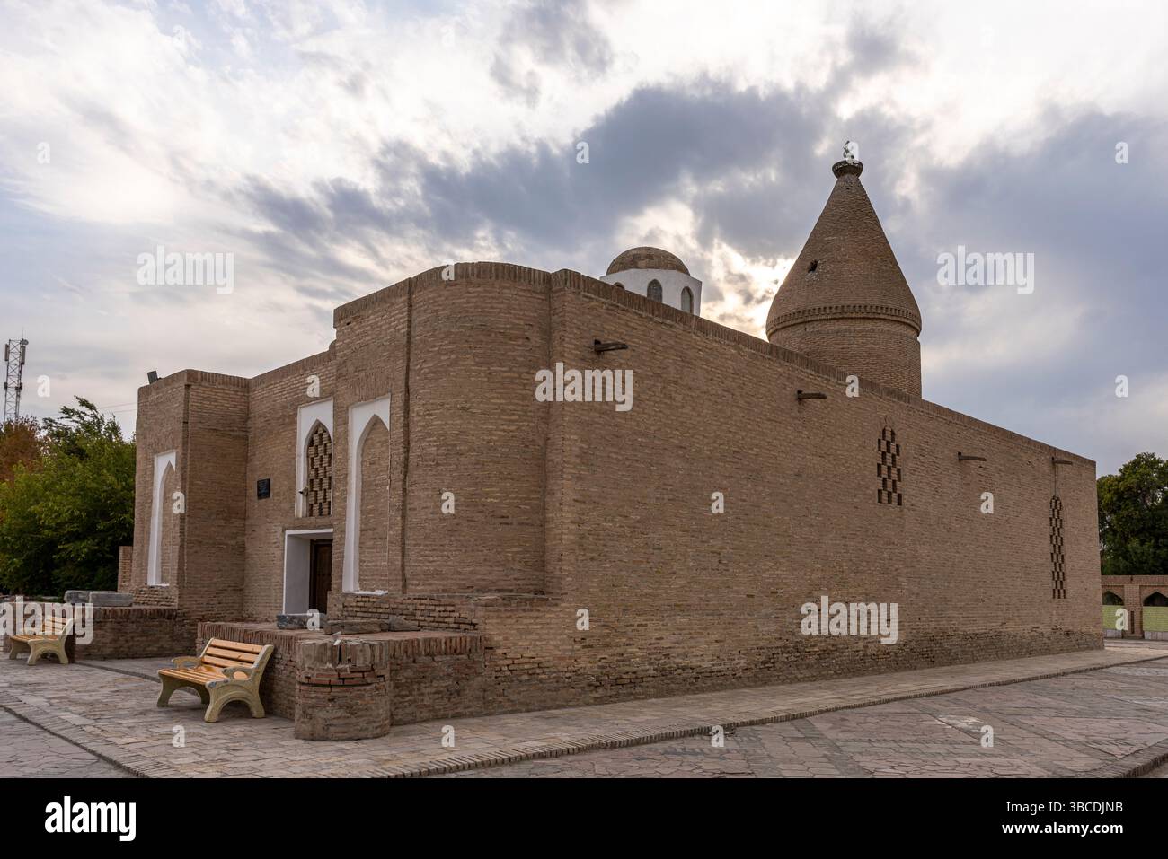 Chashma-Ayub Mausoleum in Bukhara stands with conical domes and simple ...