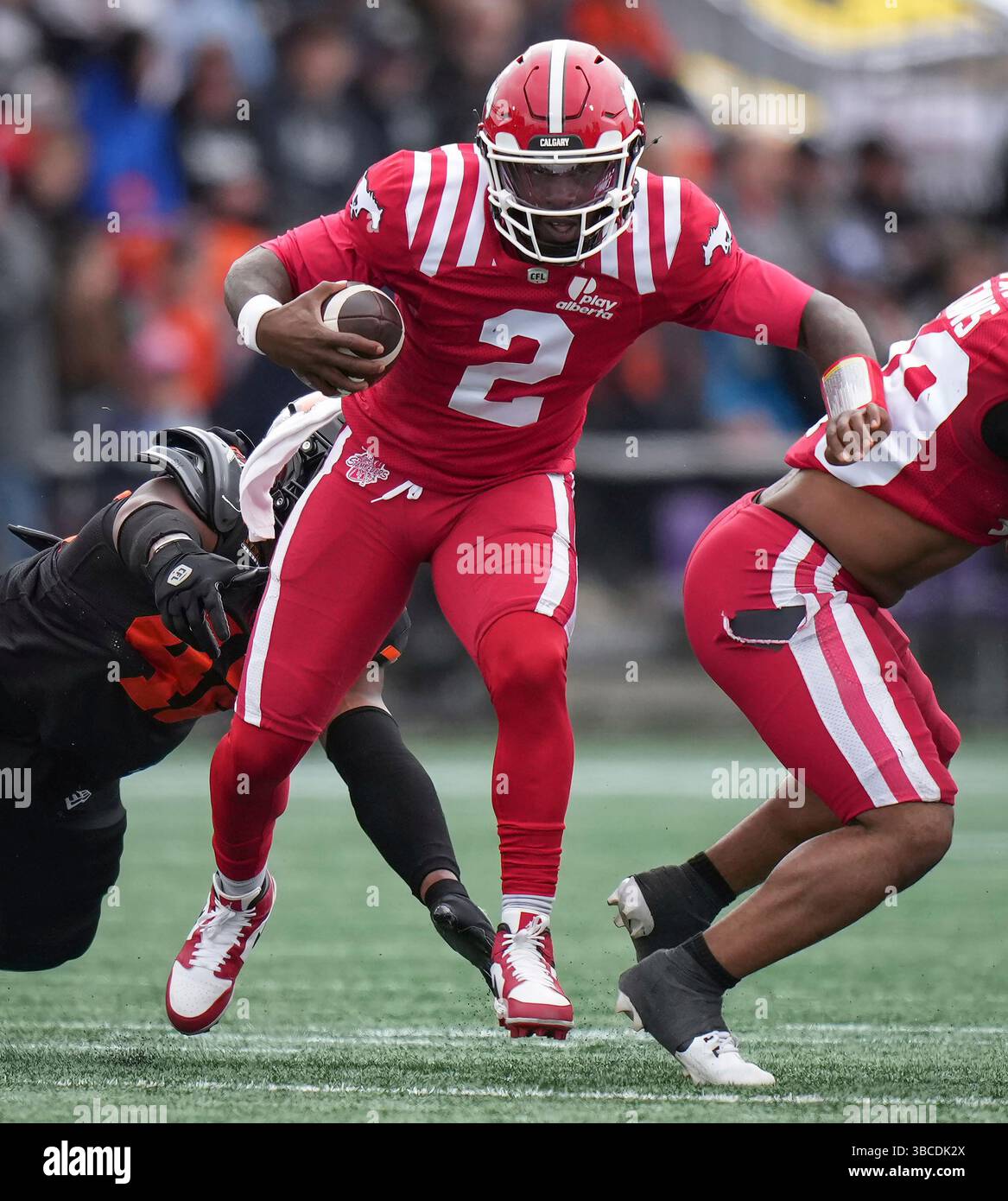Calgary Stampeders quarterback P.J. Walker (2) runs the ball during the ...