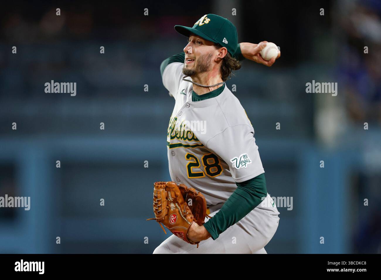 Mitch Spence #28 of the Athletics throws a pitch during a game against ...