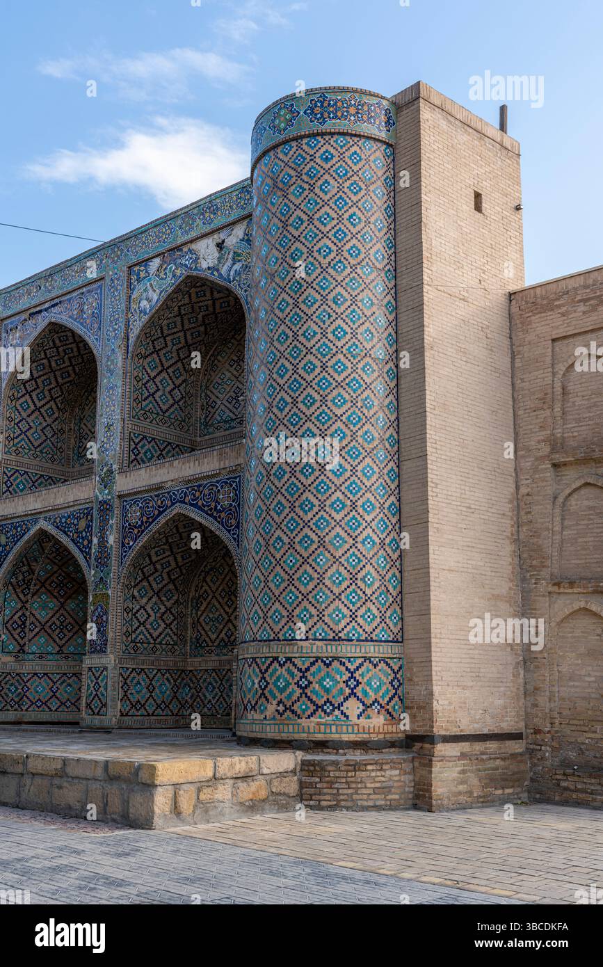 A rounded tower with blue tiles marks the entrance of Nadir Divan Begi ...