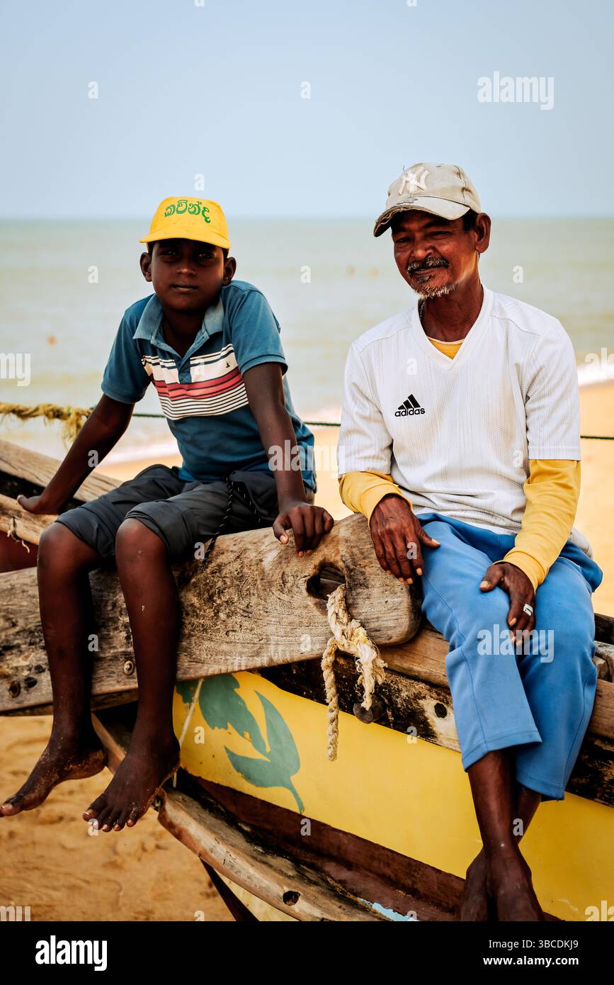 Negombo, Sri Lanka - February 23, 2025: Fishermen and vendors along the ...