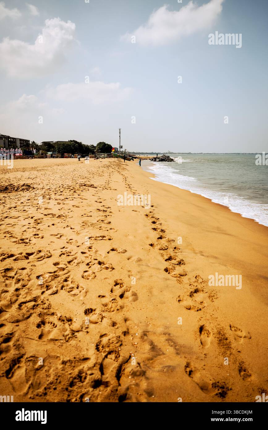Negombo, Sri Lanka - February 23, 2025: Fishermen and vendors along the ...