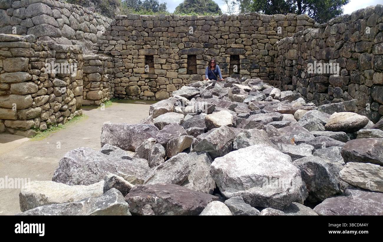 A 30-year-old Latina woman explores the archaeological site of Machu ...
