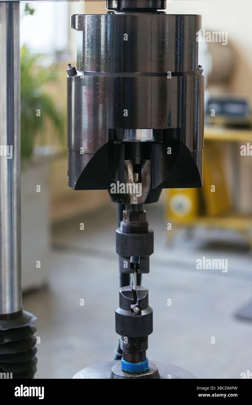 Modern laboratory equipment for testing of steel material. Press for ...