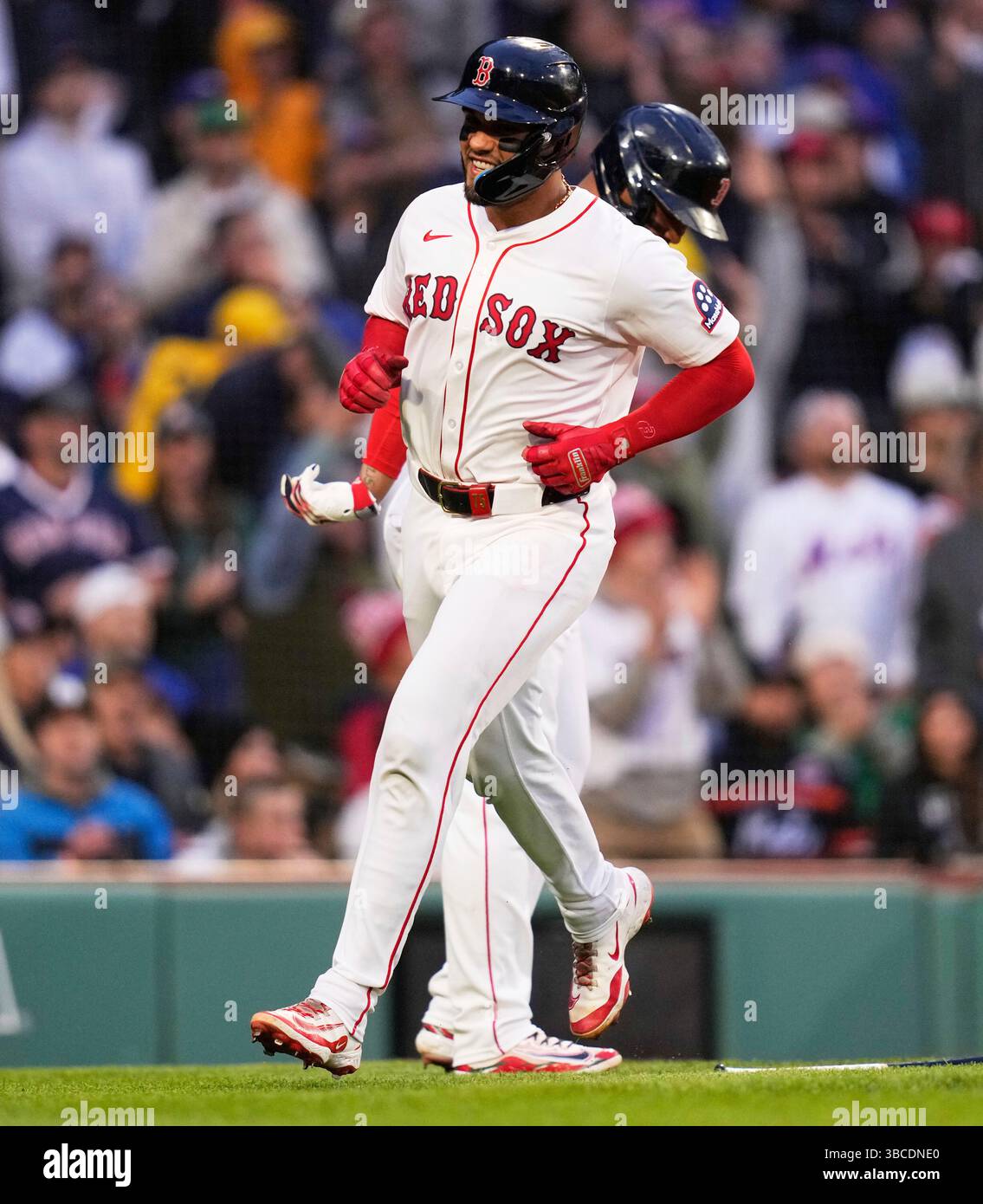 Boston Red Sox's Carlos Narváez smiles while scoring on a triple by ...