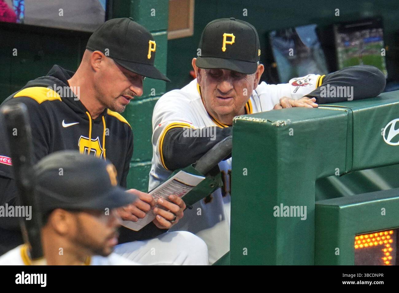 Pittsburgh Pirates manager Don Kelly, left, talks with coach Gene ...