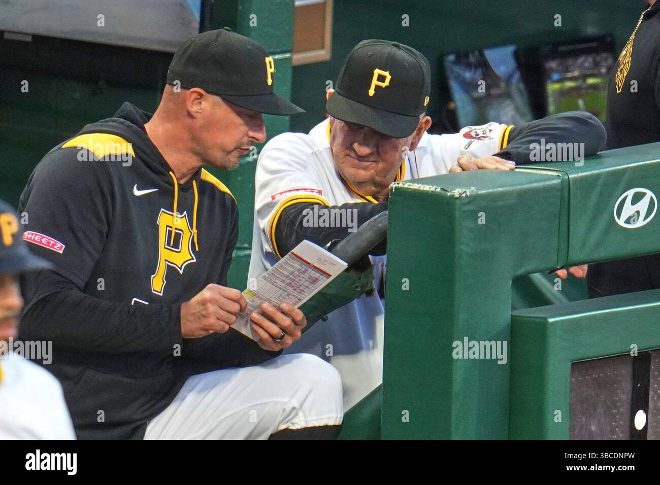 Pittsburgh Pirates manager Don Kelly, left, talks with coach Gene ...