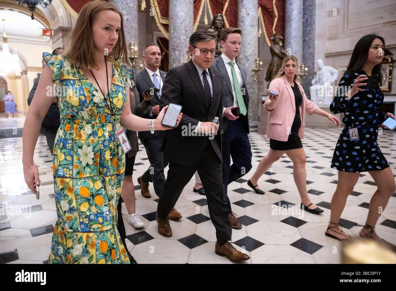House Speaker Mike Johnson (R-La.) speaks with reporters as he walks to ...