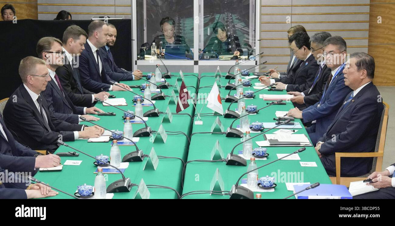 Japanese Prime Minister Shigeru Ishiba (far R) holds talks with Latvian ...