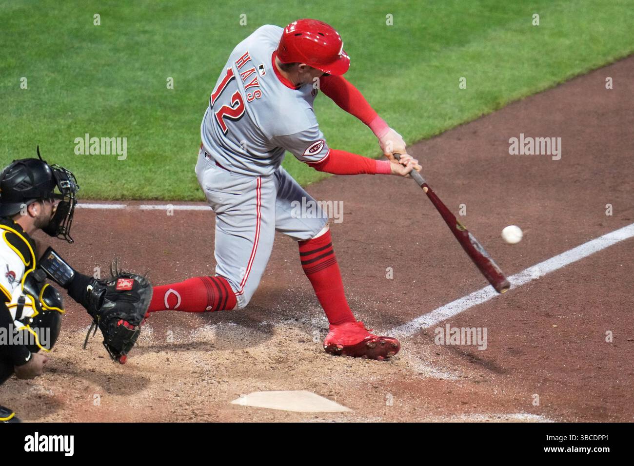 Cincinnati Reds' Austin Hays (12) singles off Pittsburgh Pirates ...