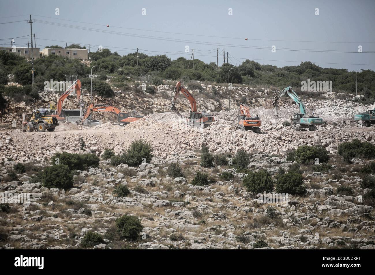 Salfit, Palestine. 19th May, 2025. Israeli bulldozers seen leveling ...