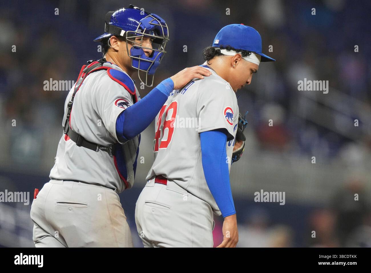 Chicago Cubs catcher Miguel Amaya, left, talks with relief pitcher ...