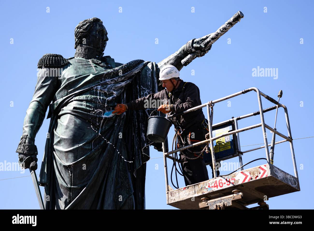 An employee of the Museum of Urban Sculpture seen during the washing of ...