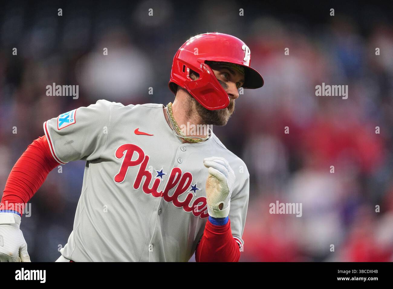 Philadelphia Phillies' Bryce Harper rounds first base after hitting an ...