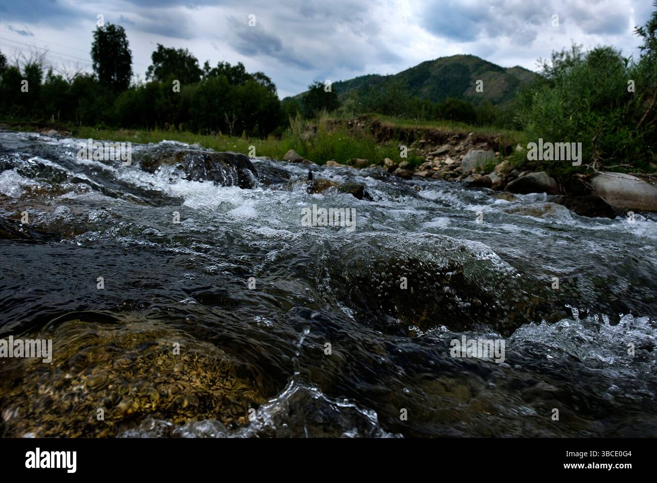 the rapid running of mountain rivers on a quiet summer evening Stock ...