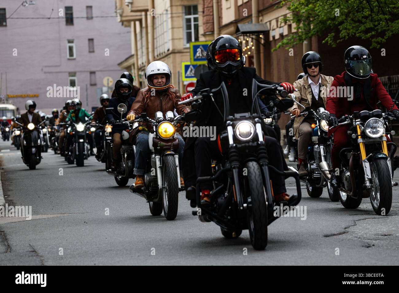 Participants ride their motorcycles during the start of the ...